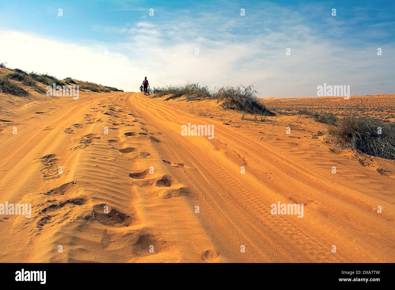 Two unidentified runners running in desert in sunrise Stock Photo - Alamy