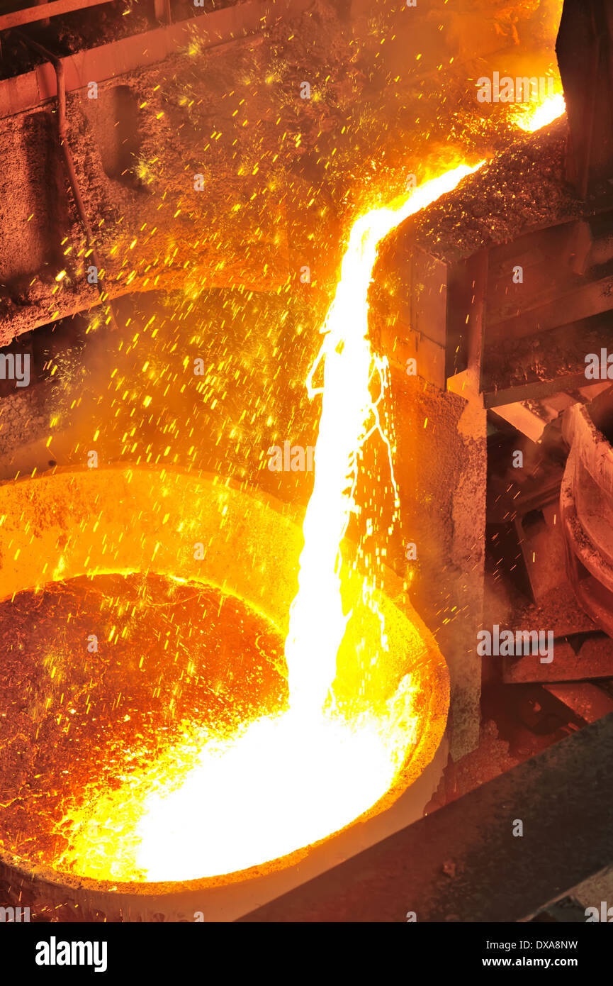 Pouring of liquid metal in open hearth workshop Stock Photo - Alamy