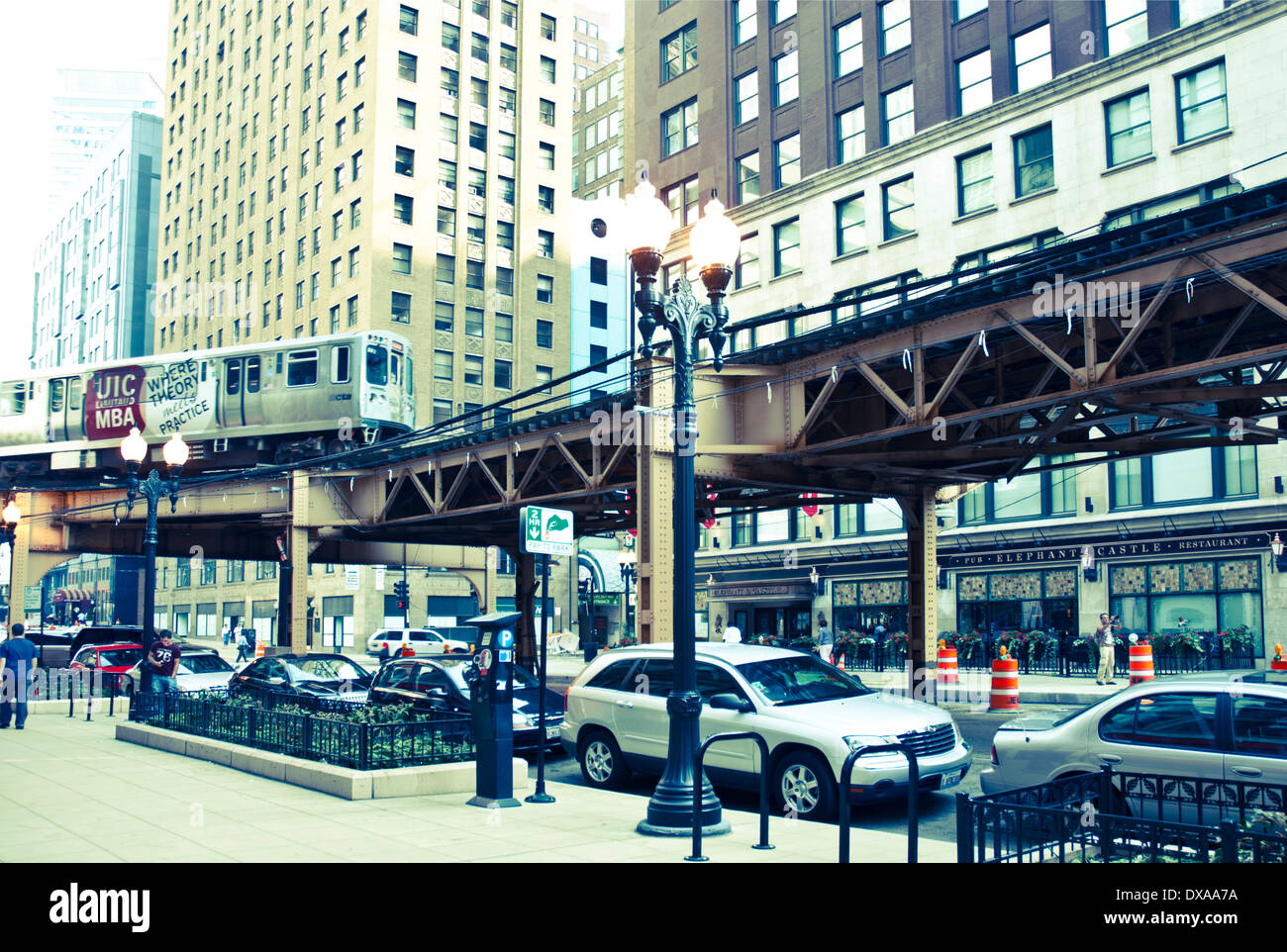 Loop train riding above a street in Chicago Stock Photo - Alamy