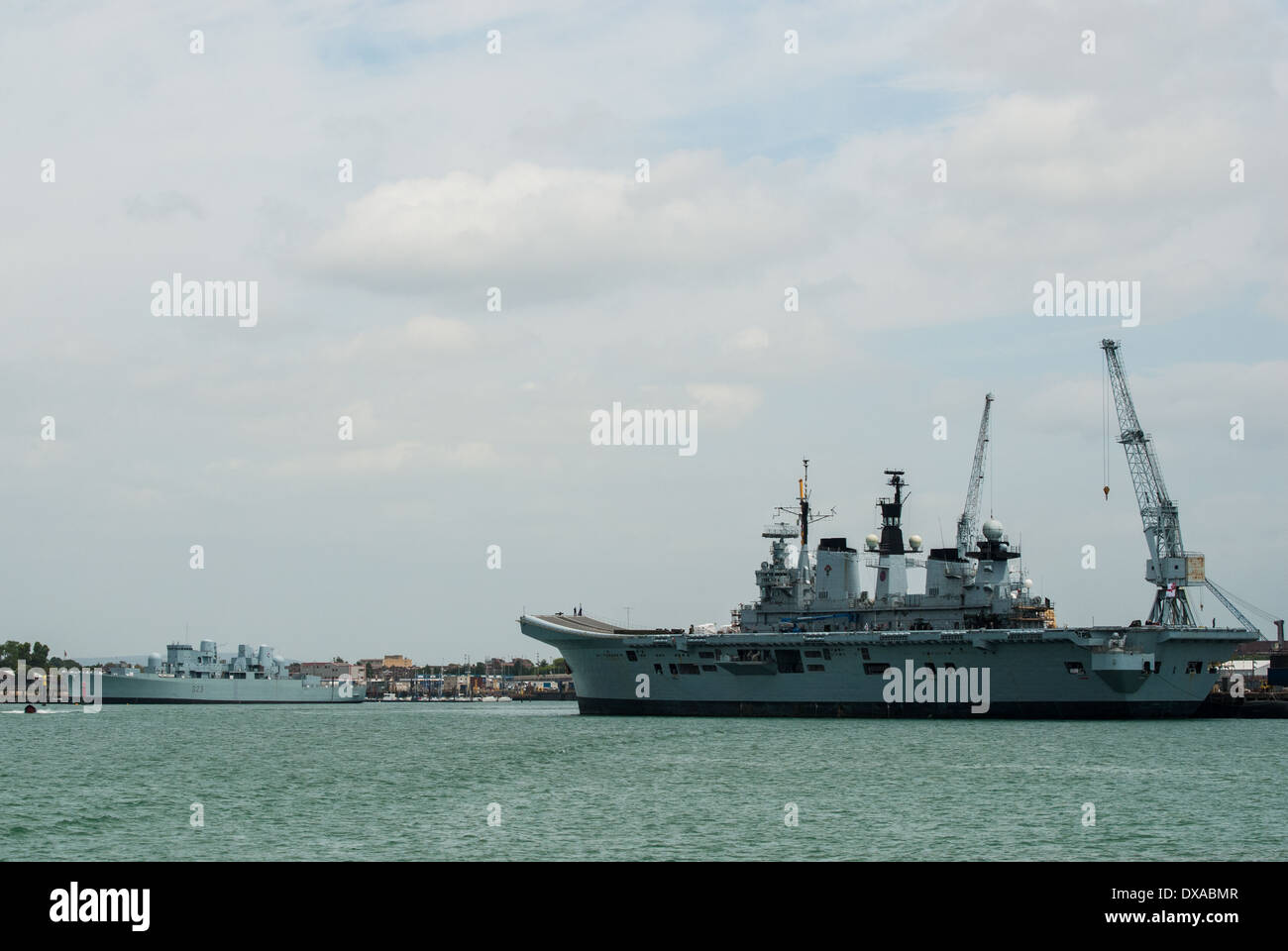 HMS Illustrious (pictured right) at the Royal Navy base at Portsmouth ...
