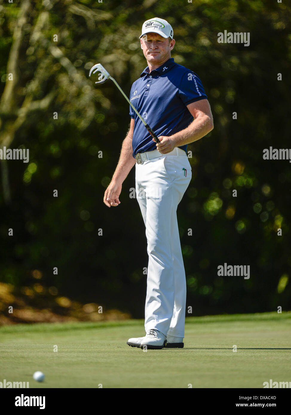 Orlando, Florida, USA. 21st March 2014. Jamie Donaldson watches his ...