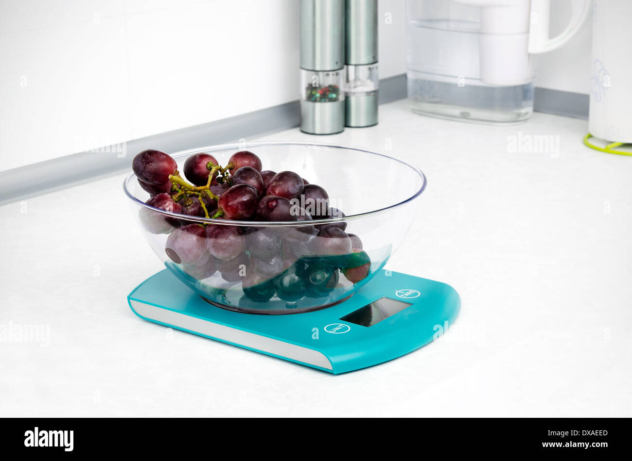 Grapes on scale in modern kitchen Stock Photo - Alamy