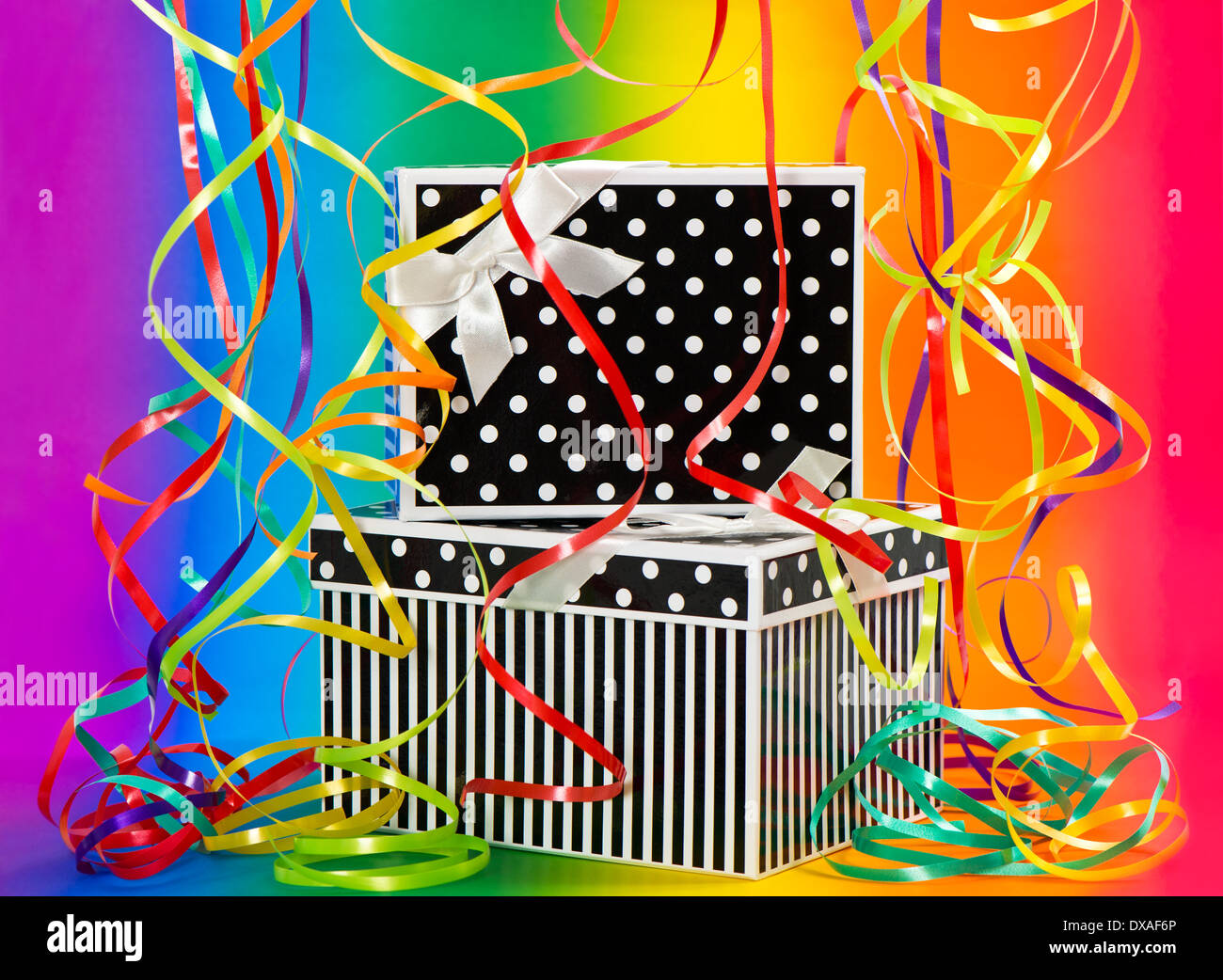 Colorful party or holiday decoration. gifts on rainbow background with ...