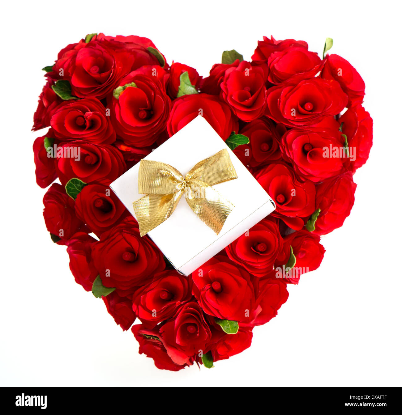 heart of red roses with gift and golden bow on white background Stock ...