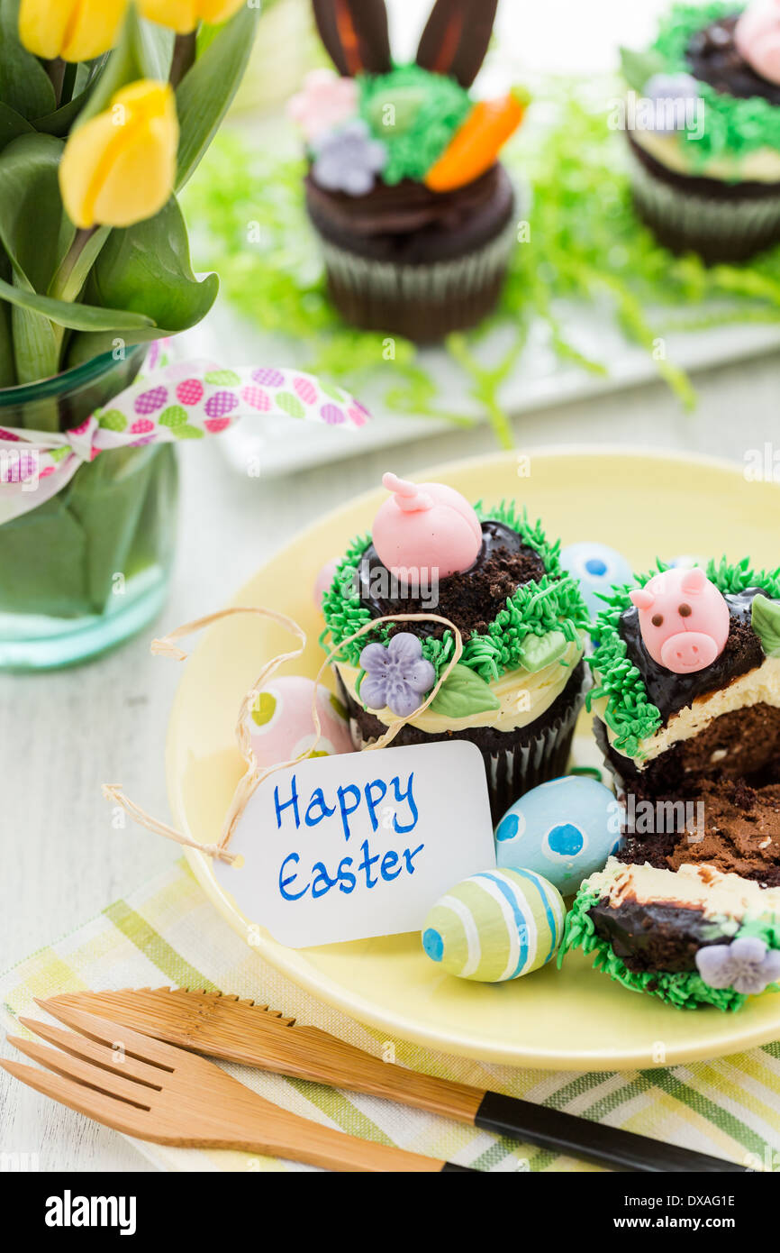 Easter chocolate cupcakes decorated with piggy and bunny ears Stock ...