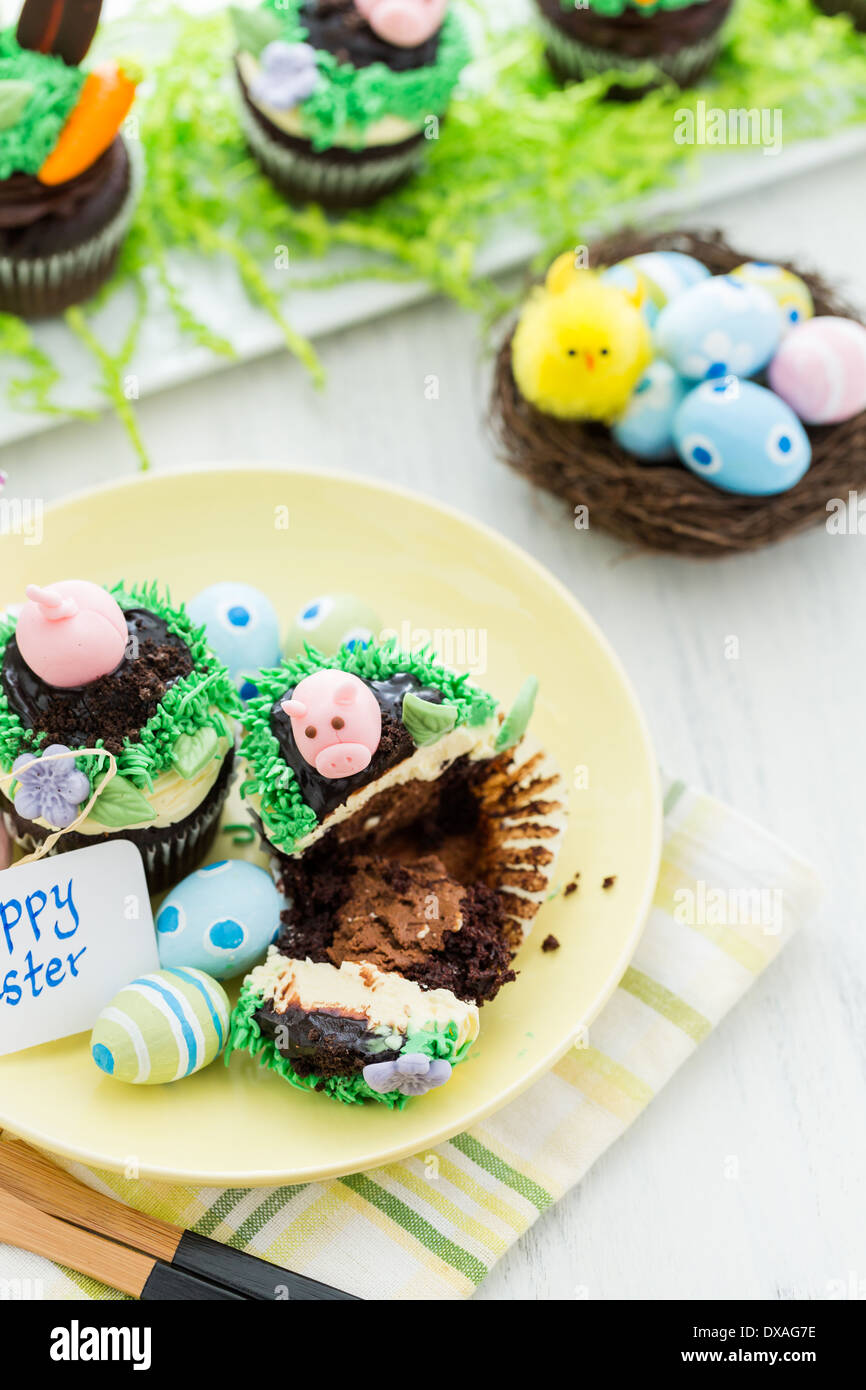 Easter chocolate cupcakes decorated with piggy and bunny ears Stock ...