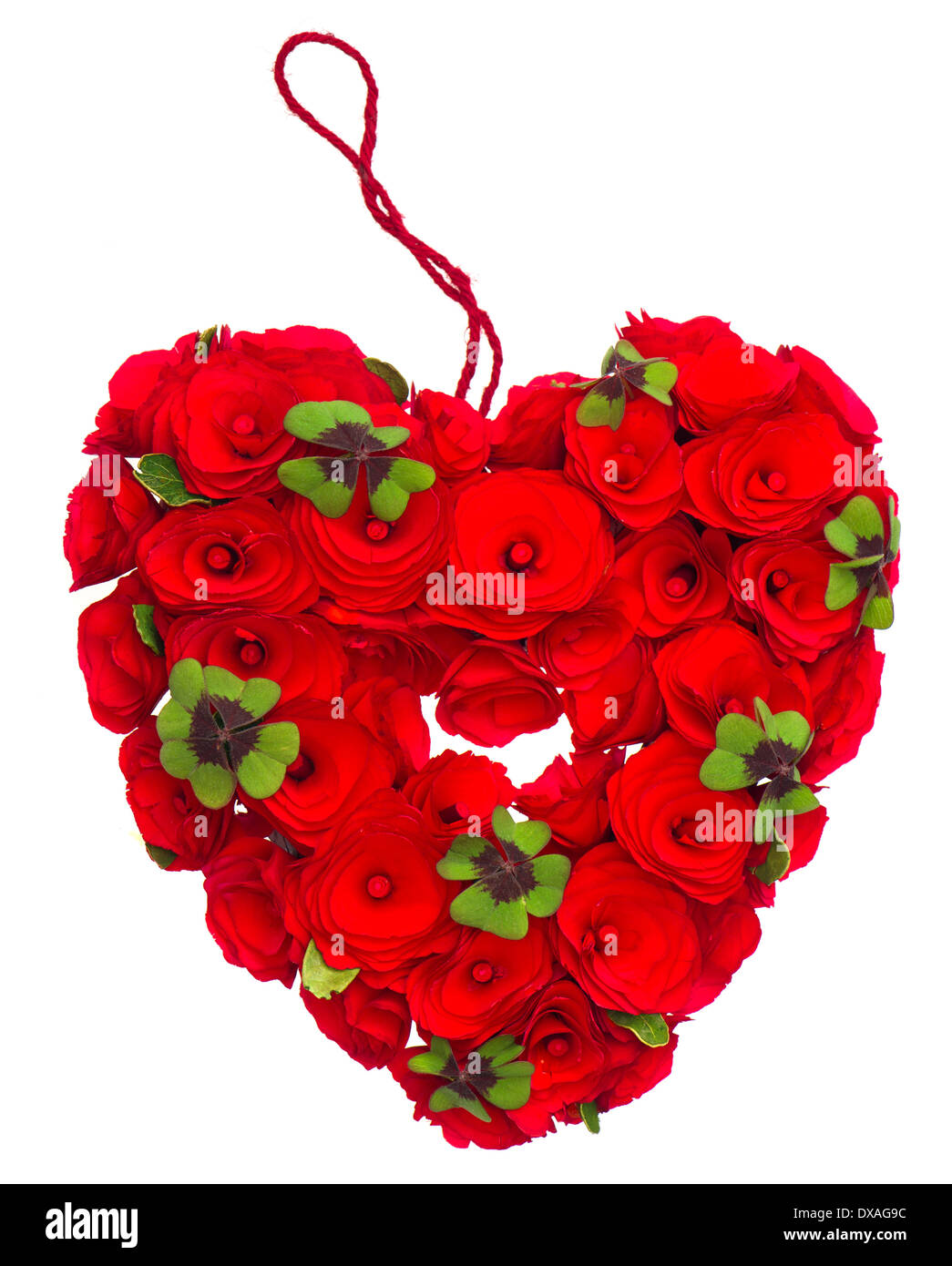 red heart of roses and clover leaves on white background Stock Photo ...