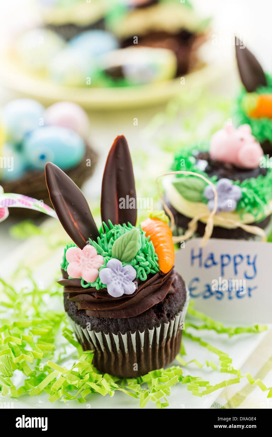 Easter chocolate cupcakes decorated with piggy and bunny ears Stock ...