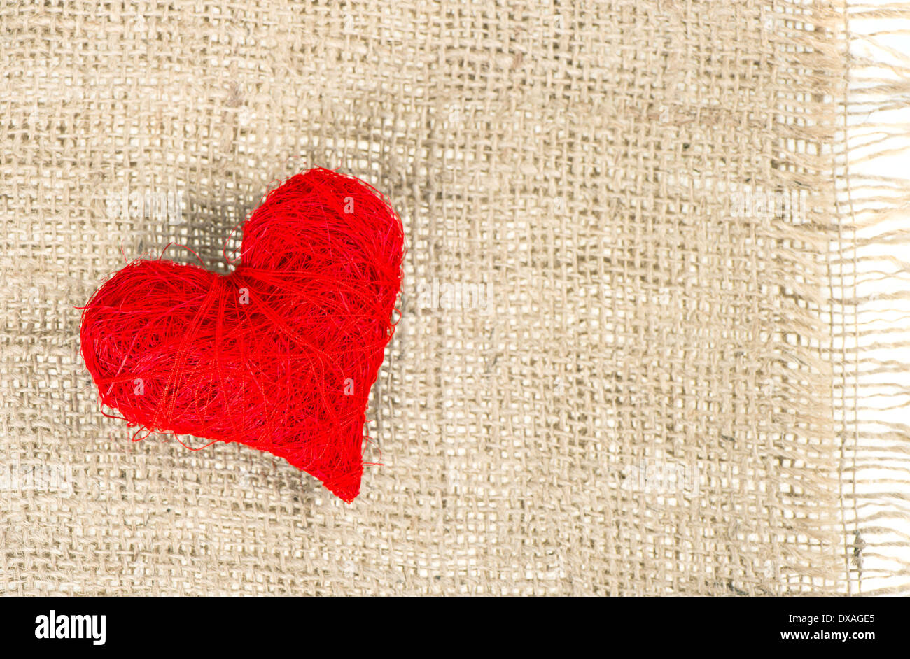 red heart on burlap background Stock Photo - Alamy