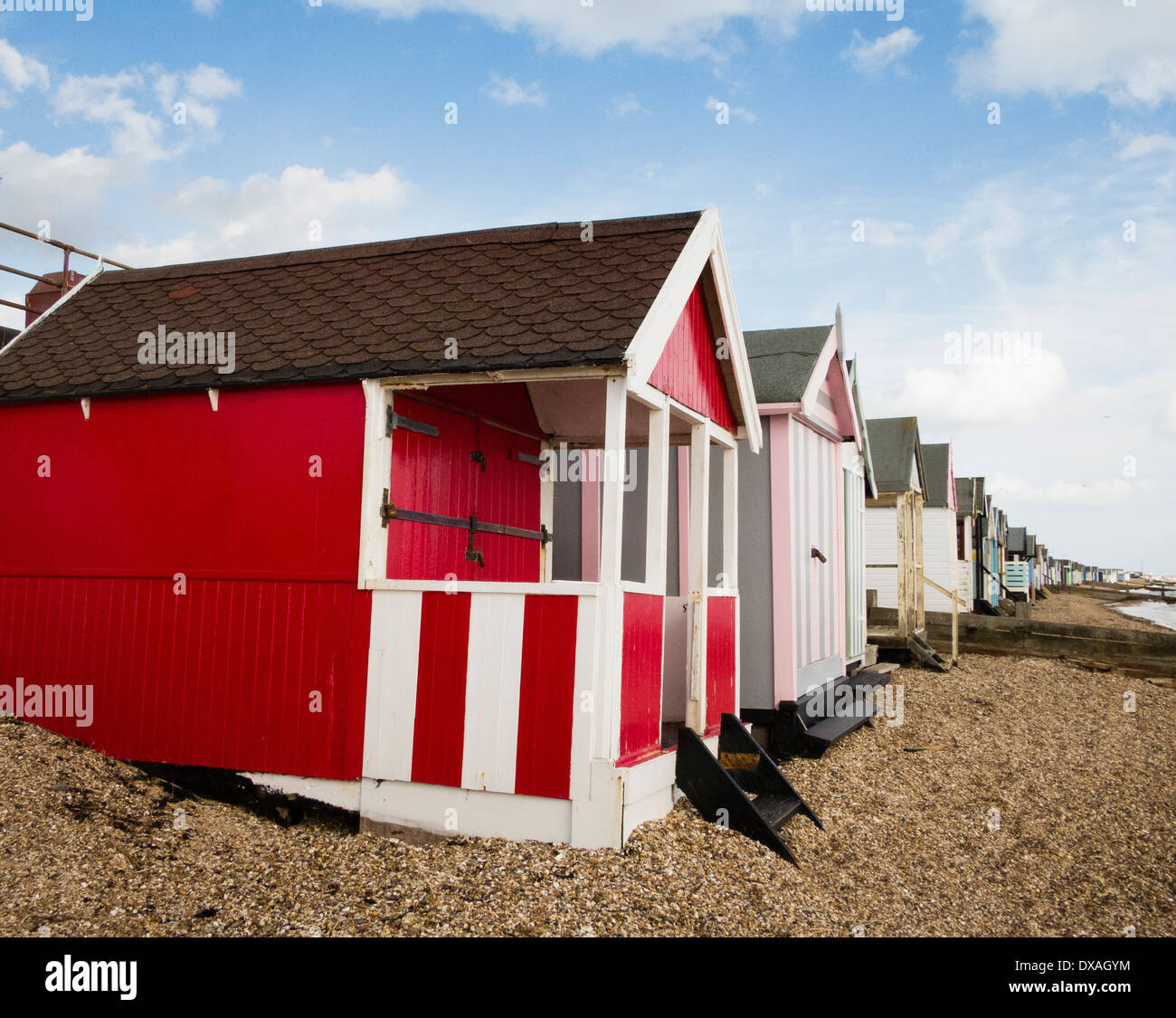 red beach hut on the shoreline Stock Photo - Alamy