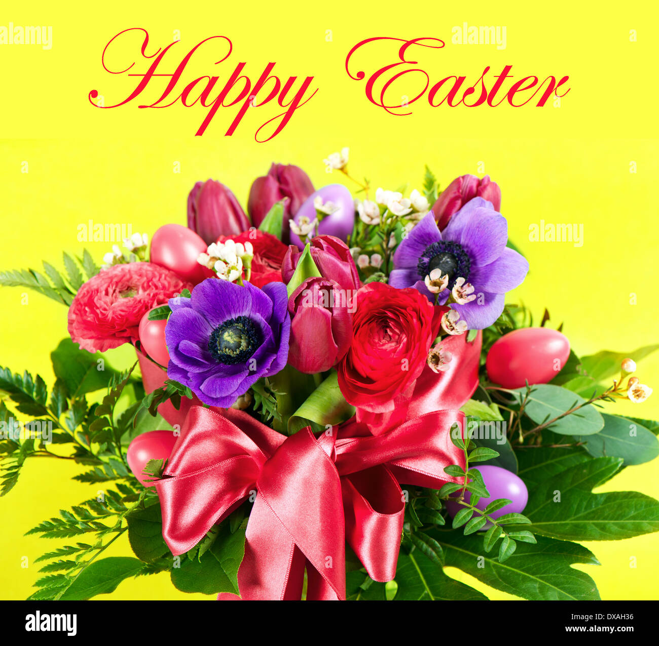 bouquet of colorful spring flowers with easter eggs over yellow ...