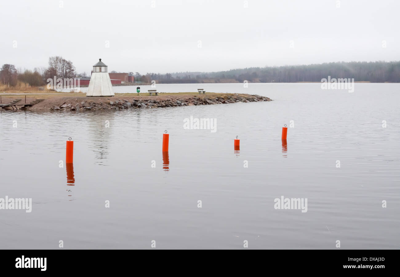 Lighthouse and four red buoys in small city of Åmål Dalsland Sweden in ...