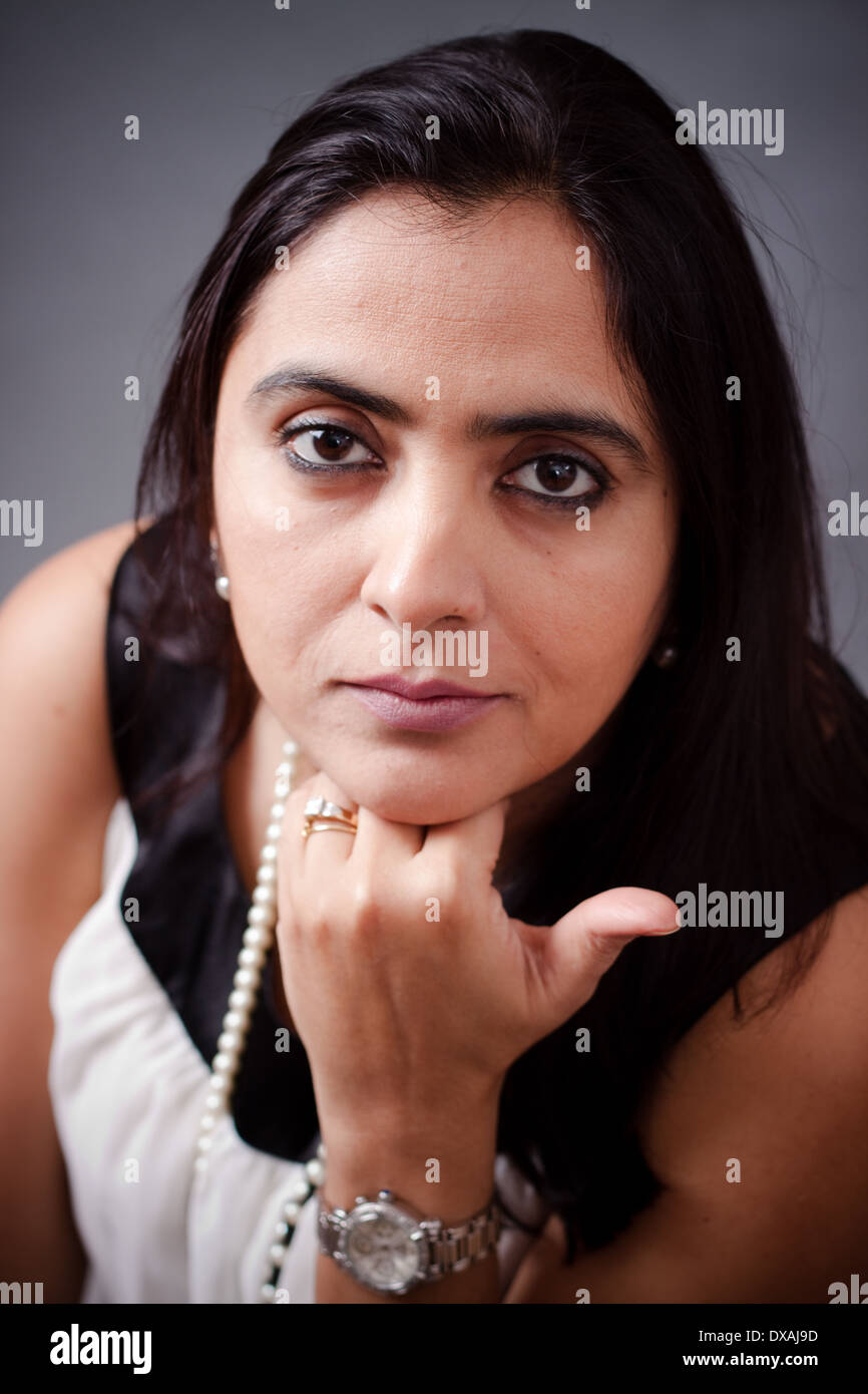 Portrait of a beautiful East Indian woman against a gray backdrop Stock ...