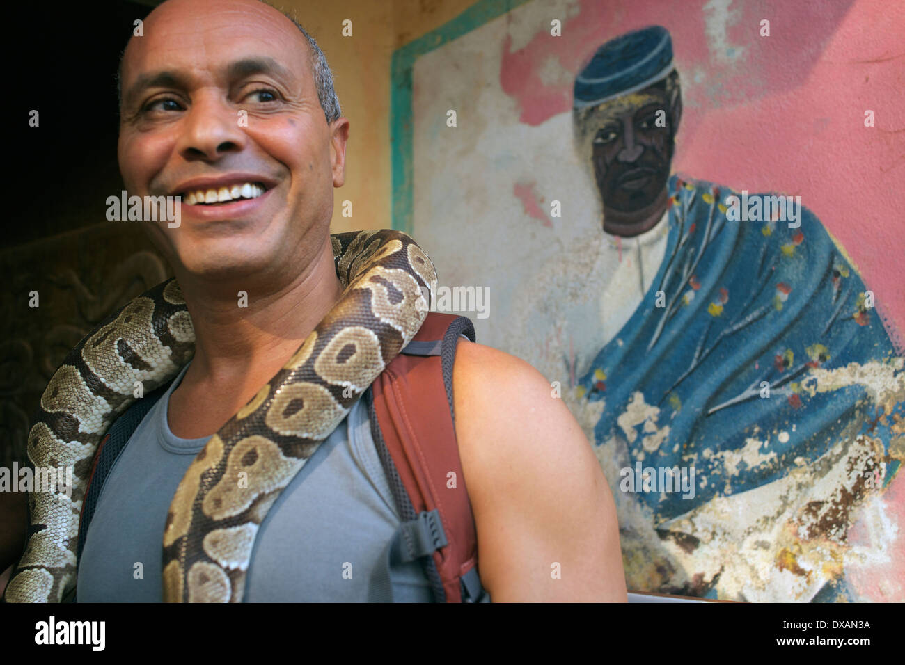 Tourist posing with a snake around his neck, Benin, West Africa Stock ...