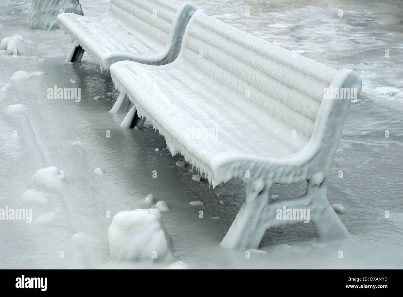 Benches covered with ice Stock Photo - Alamy