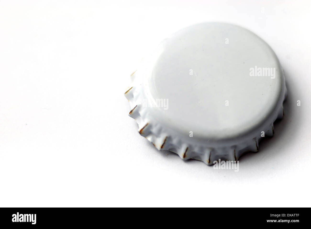 White beer bottle top / bottle top on white background Stock Photo - Alamy