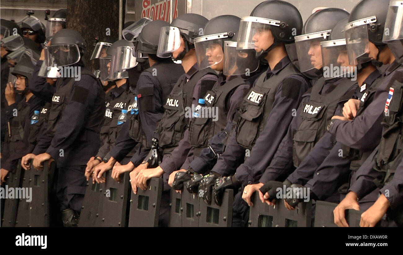 Riot Police line up against anti-government protesters during protests ...