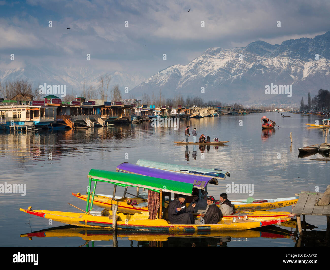 India, Kashmir, Srinagar, Dal Lake, shikaras, houseboats and snow ...