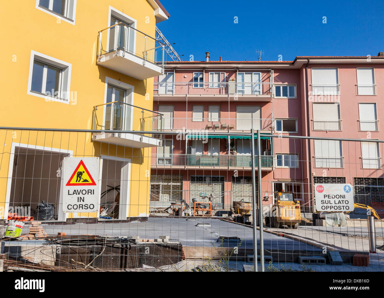 Italian new house apartment building with sign saying works in progress ...