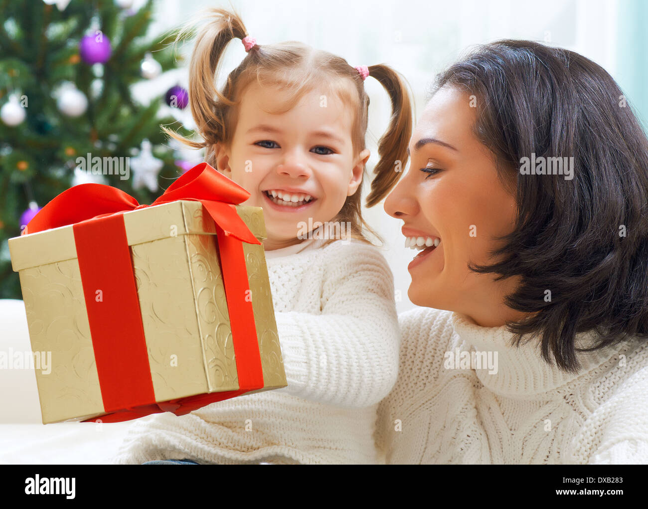 happy family with christmas gift Stock Photo - Alamy