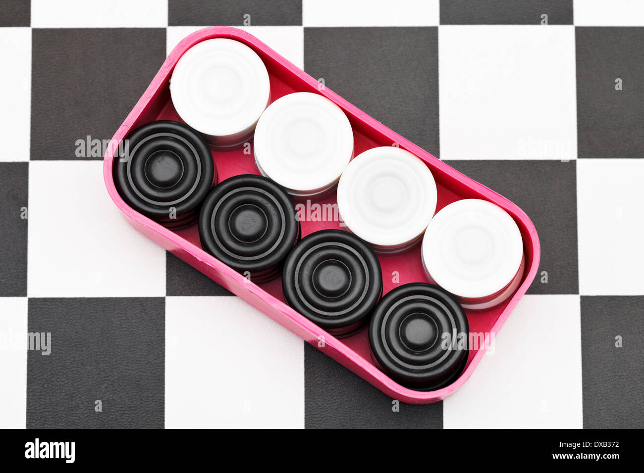 box with checkers on black and white checkerboard Stock Photo - Alamy