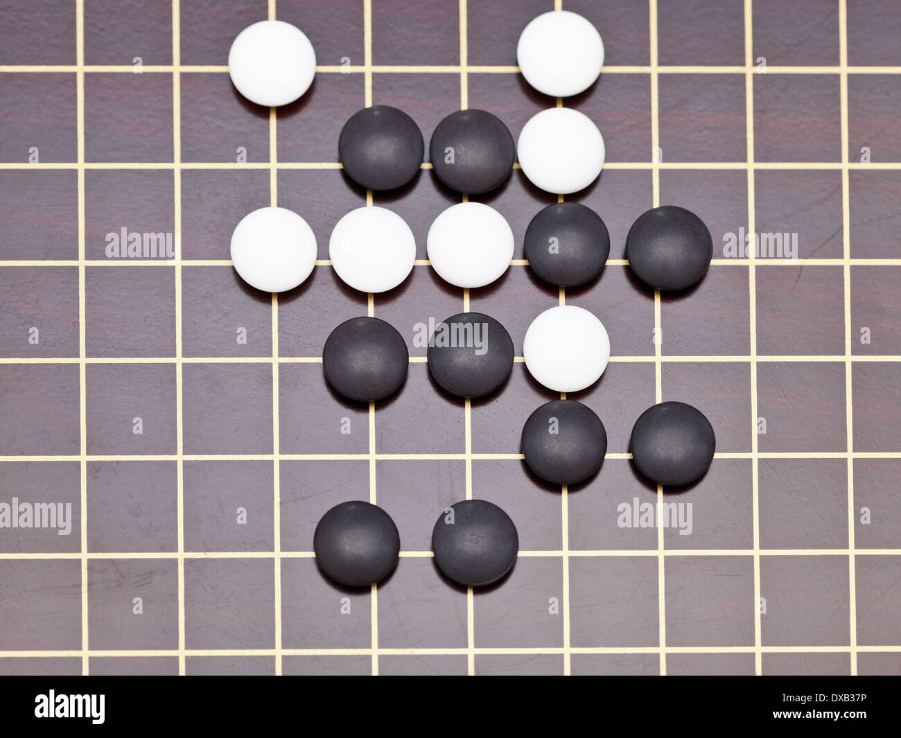 top view position of stones during go game playing on wooden goban ...