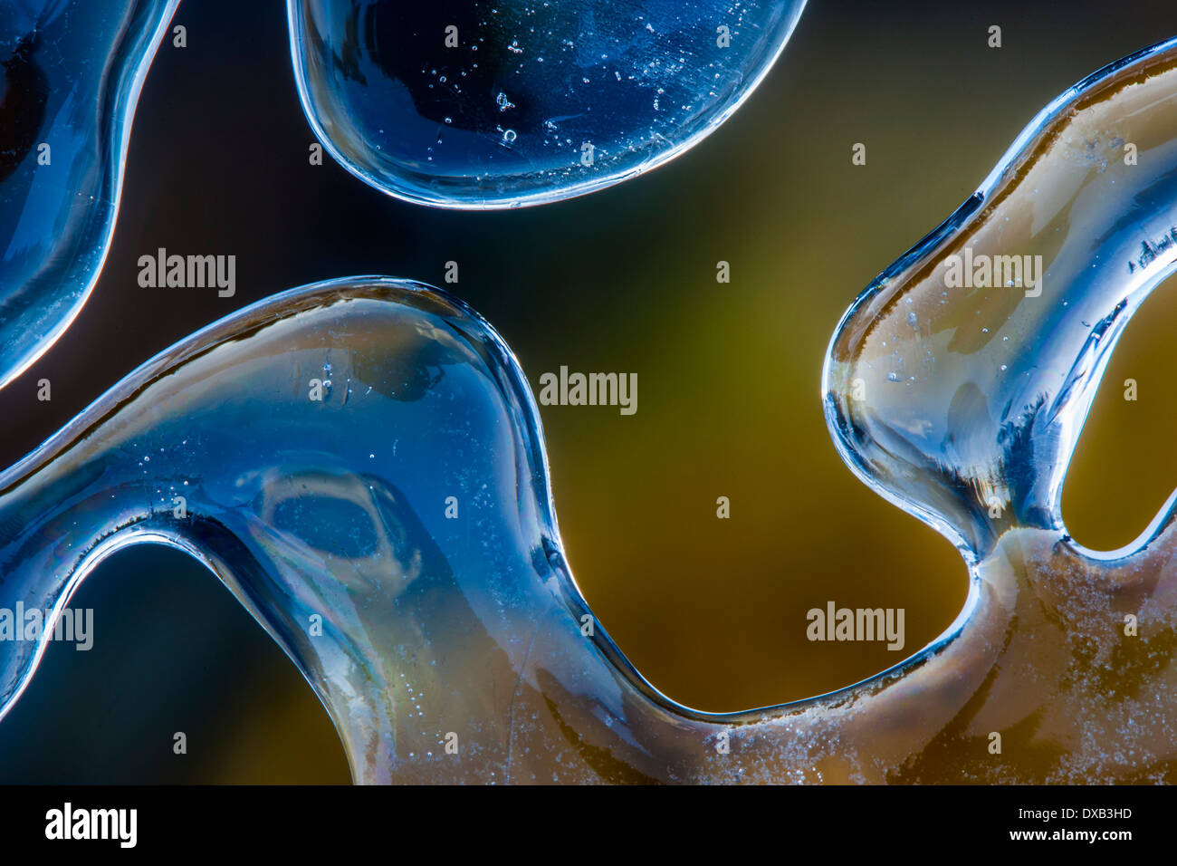 Ice frozen into a curvy shape creates an abstract pattern over the ...