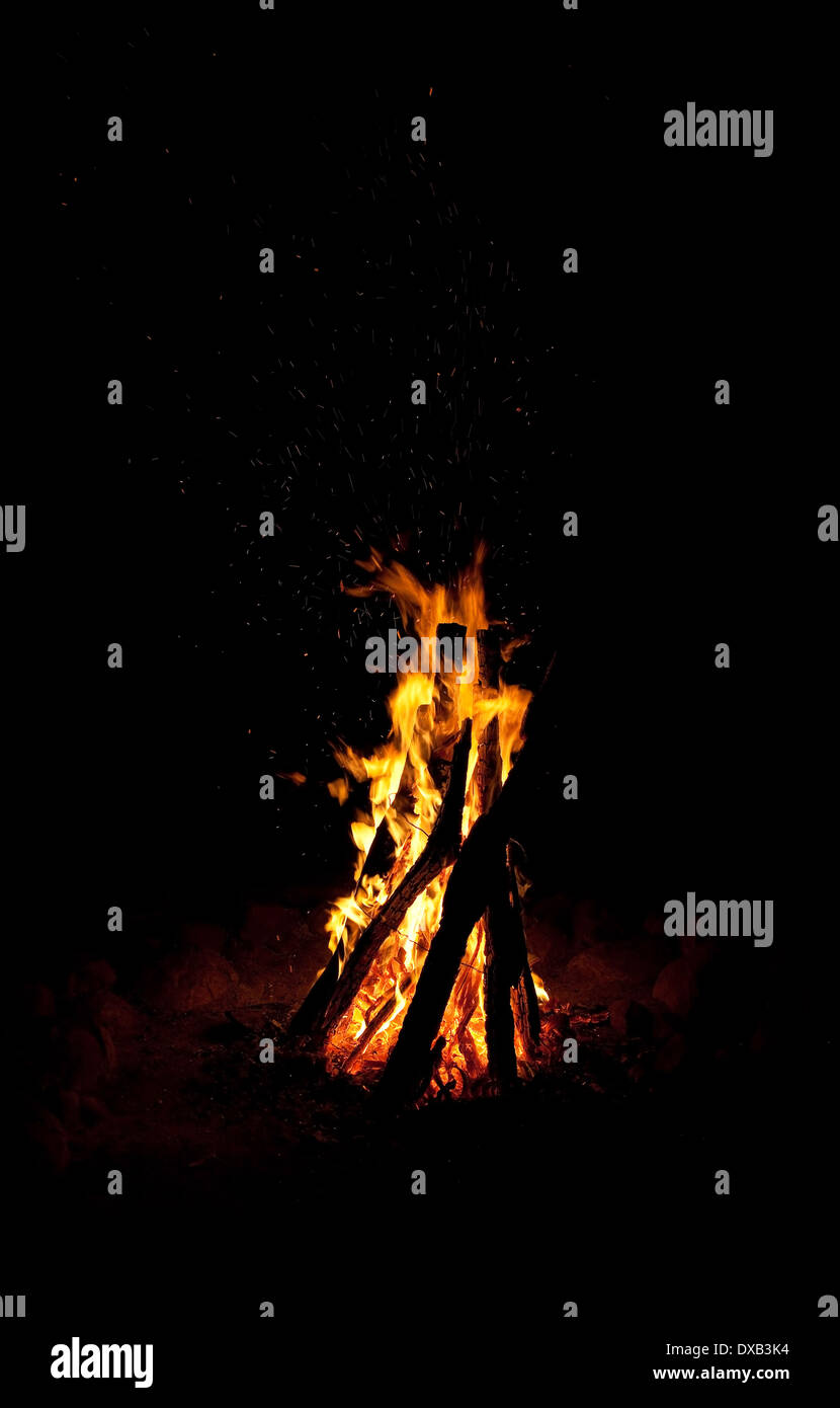 A small bonfire burning in the dark night Stock Photo - Alamy