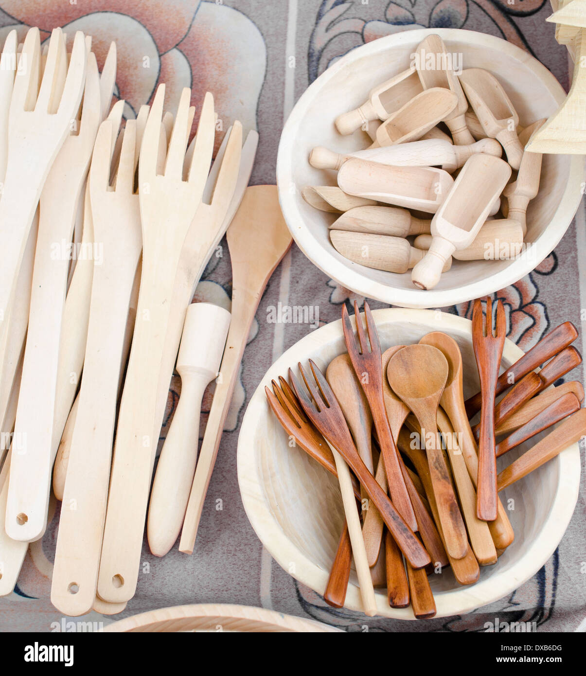 A bunch of woodens spoons on display, various shape, craftsmanship ...
