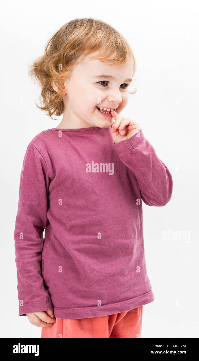 abashed caucasian girl looking to side. vertical image in light grey ...