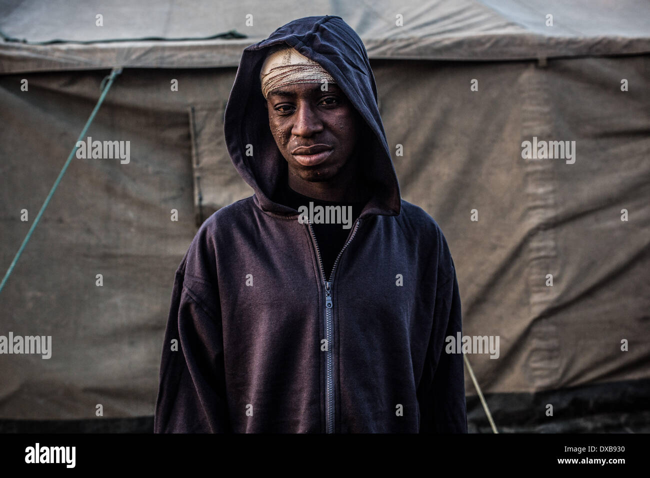 Melilla, Spain. 18th Mar, 2014. Cissé, a young boy from Mali poses for ...