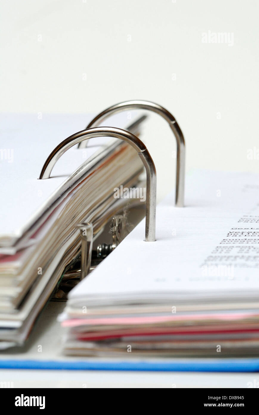 Opened filing folder with filed away documents hi-res stock photography ...