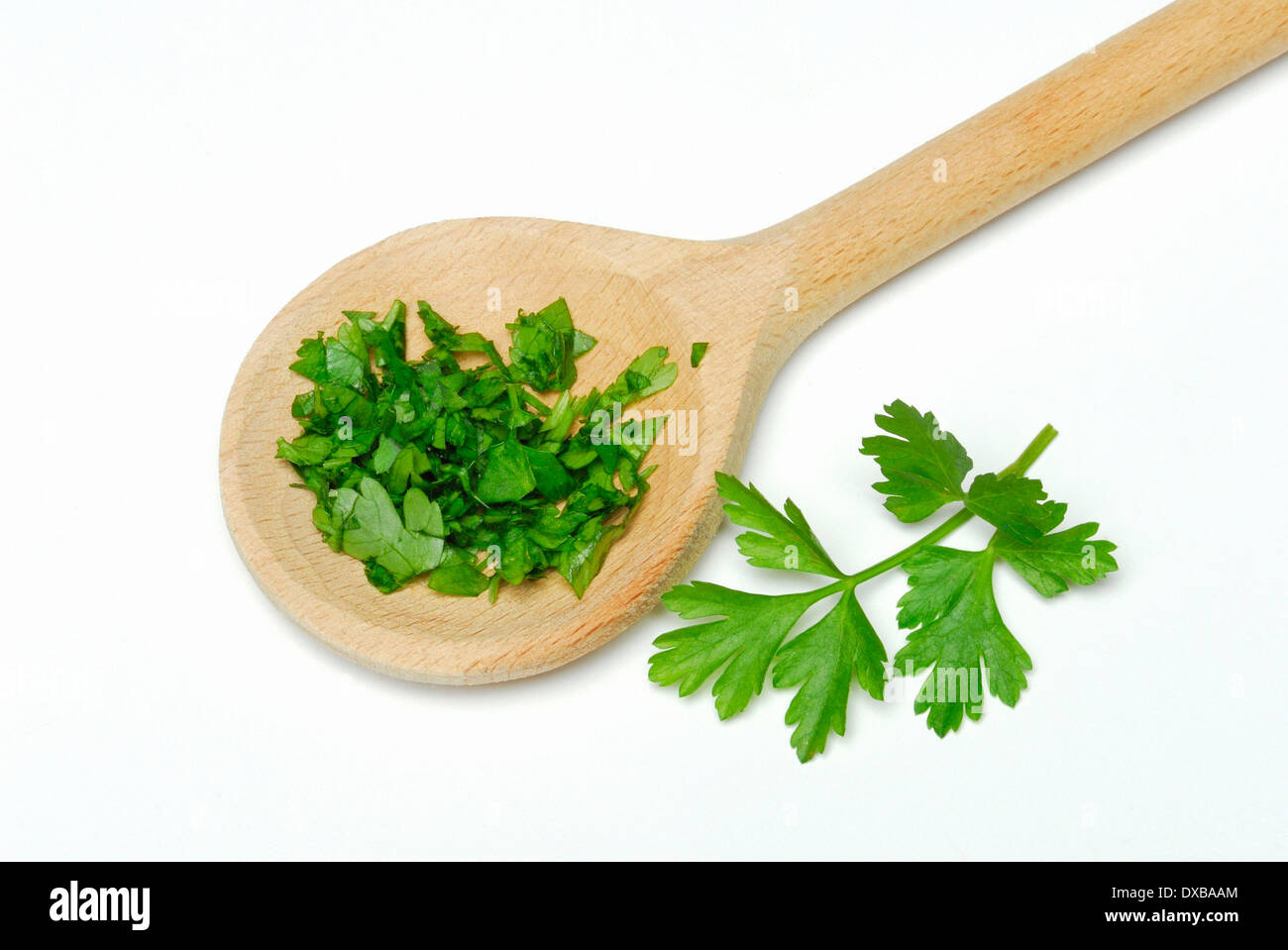Chopped parsley in wooden spoon hi-res stock photography and images - Alamy