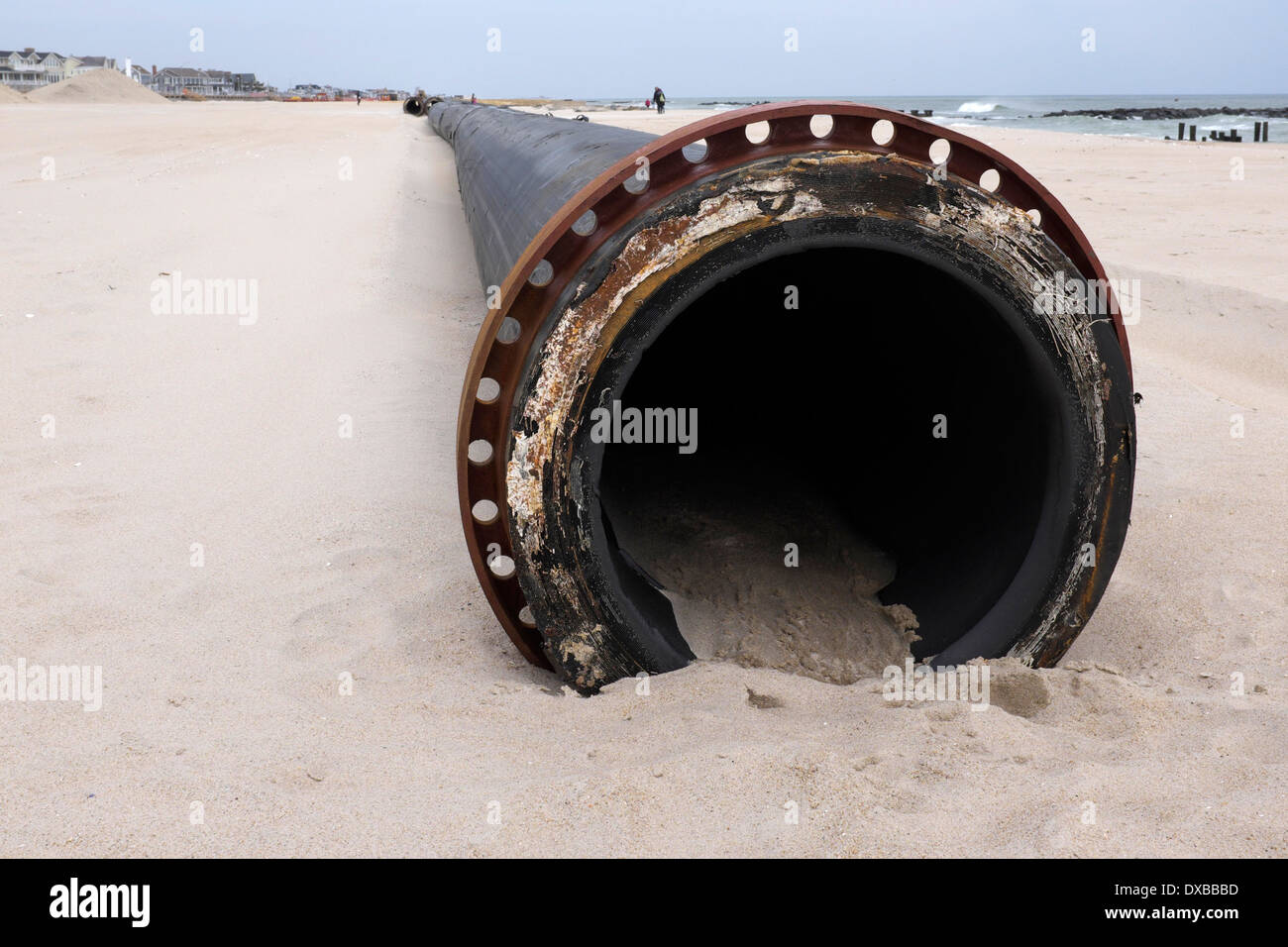 A dredge pipe on the beach Stock Photo - Alamy
