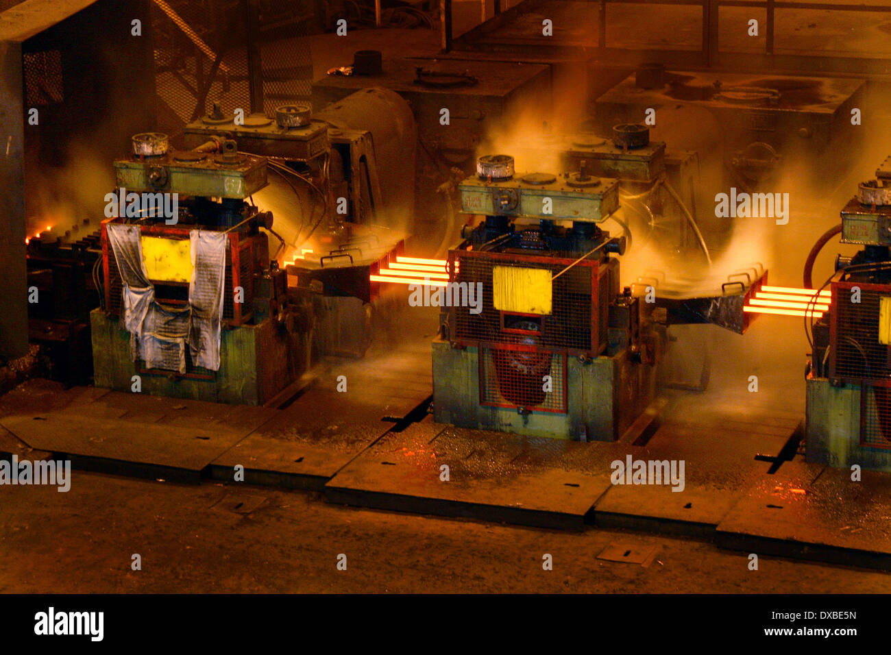 Rolling hot steel to wire rod in four strand mill Stock Photo - Alamy
