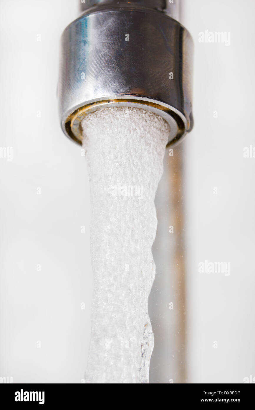 From the crane water in macro scale flows Stock Photo - Alamy