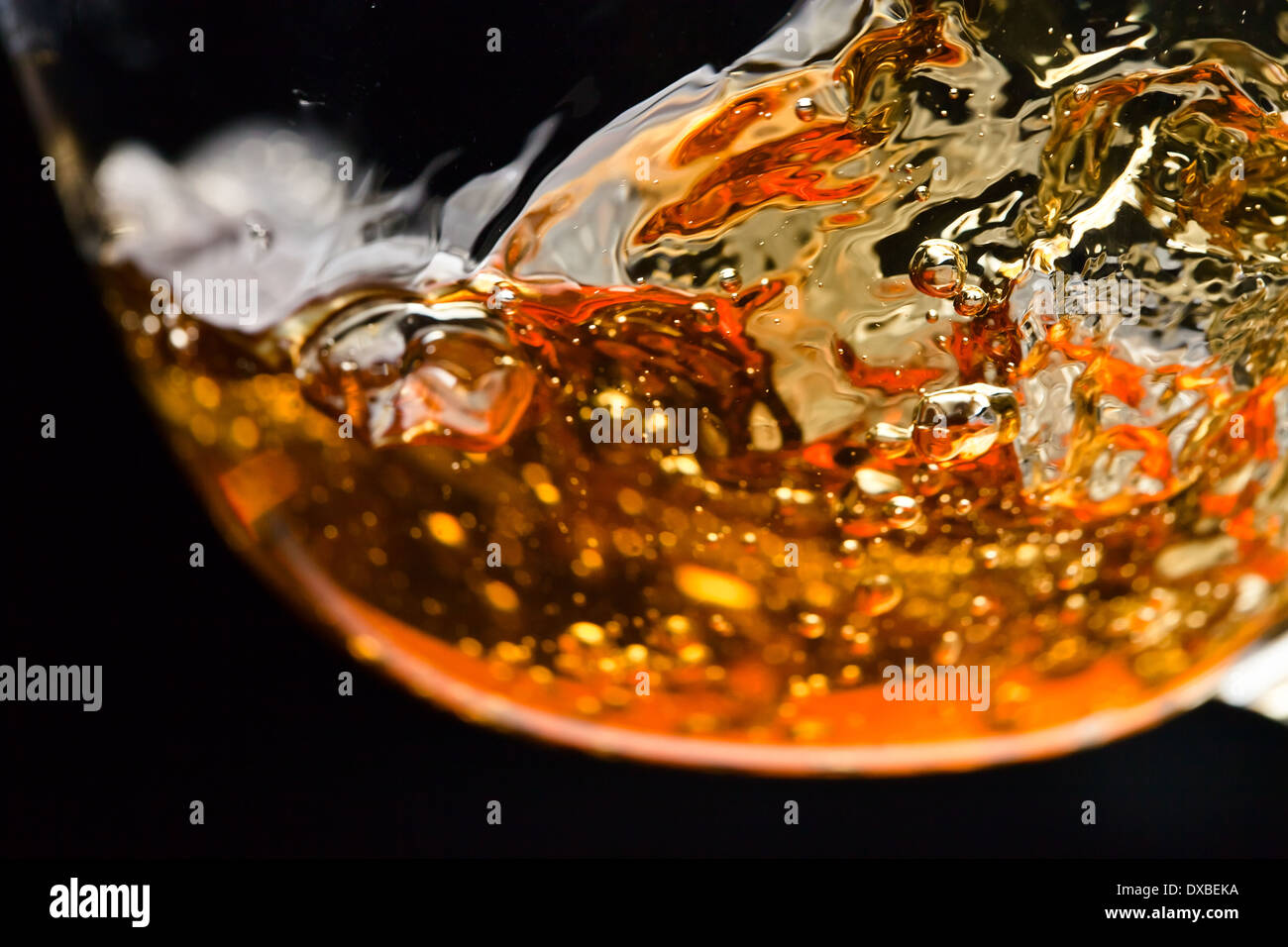 detail of an alcoholic beverage on black background Stock Photo - Alamy