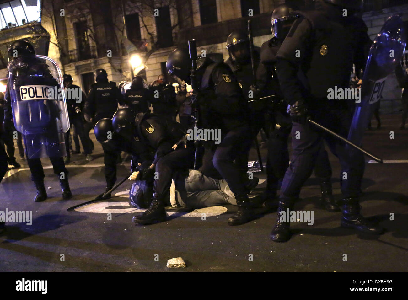 Madrid, Spain. 22nd Mar, 2014. Police in riot gear arrest a protestor ...