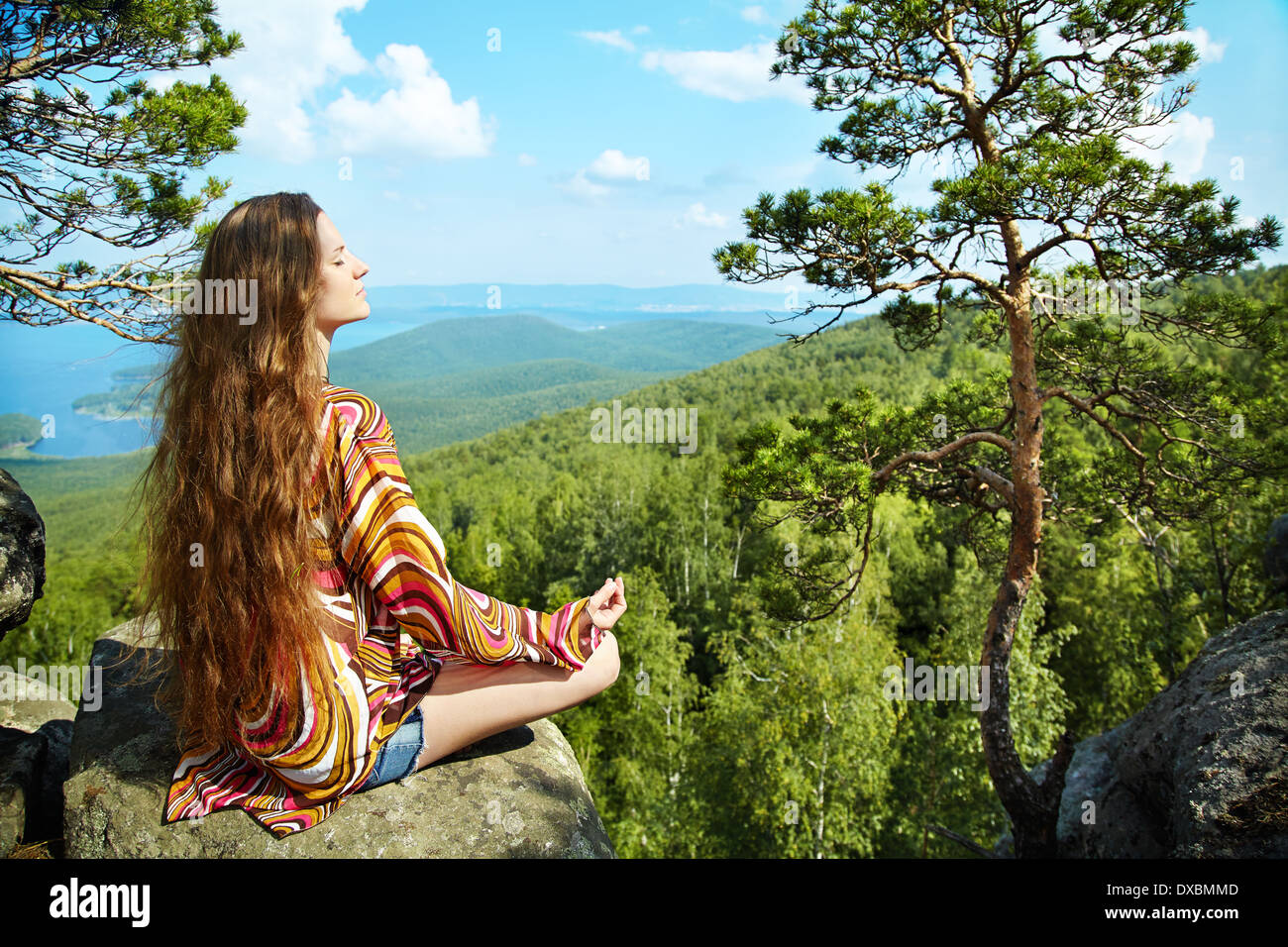 Person sitting back view meditating hi-res stock photography and images ...