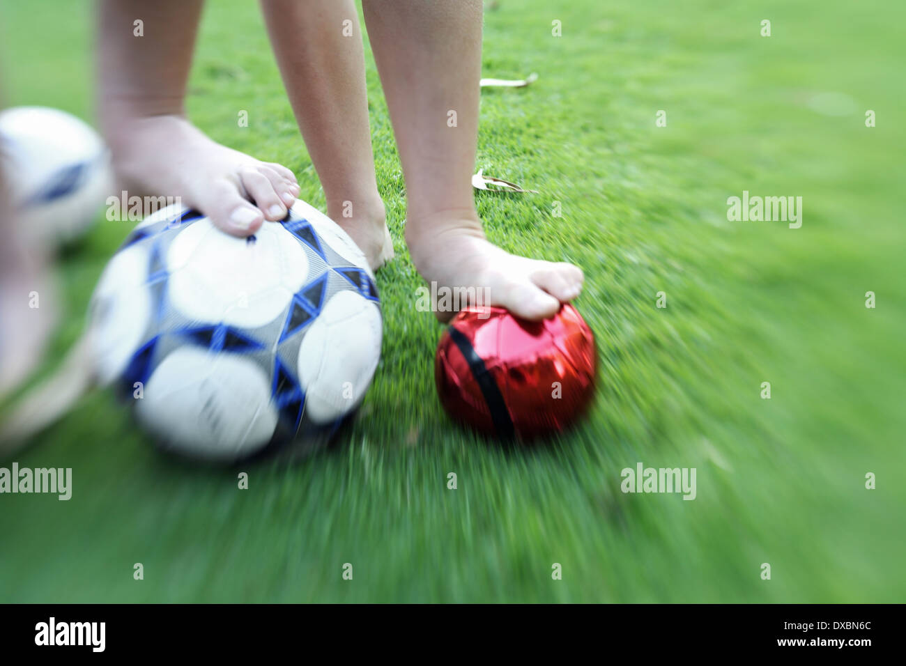 Boys playing soccer barefoot hi-res stock photography and images - Alamy