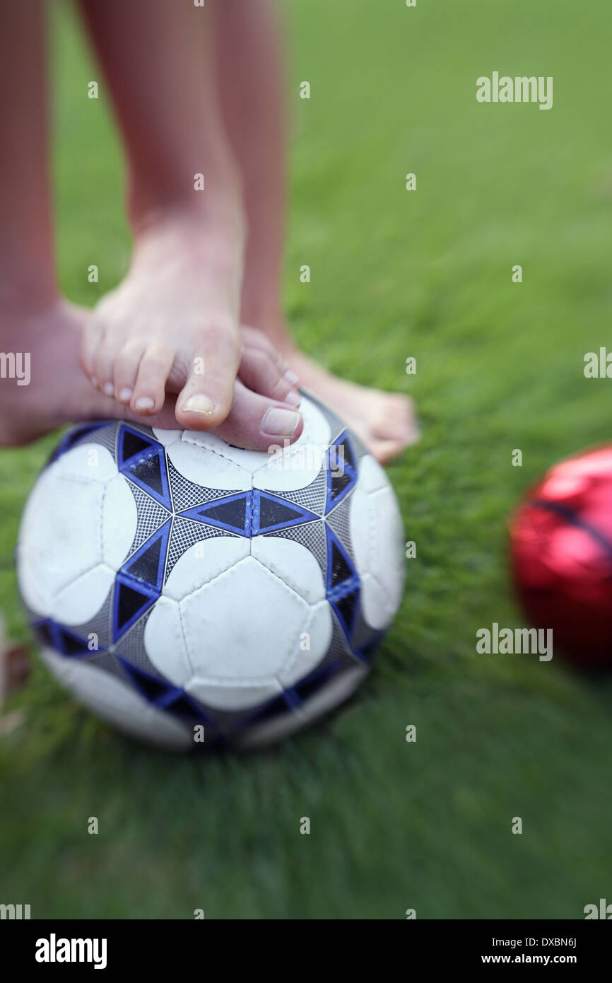 Two feet on soccer ball hi-res stock photography and images - Alamy
