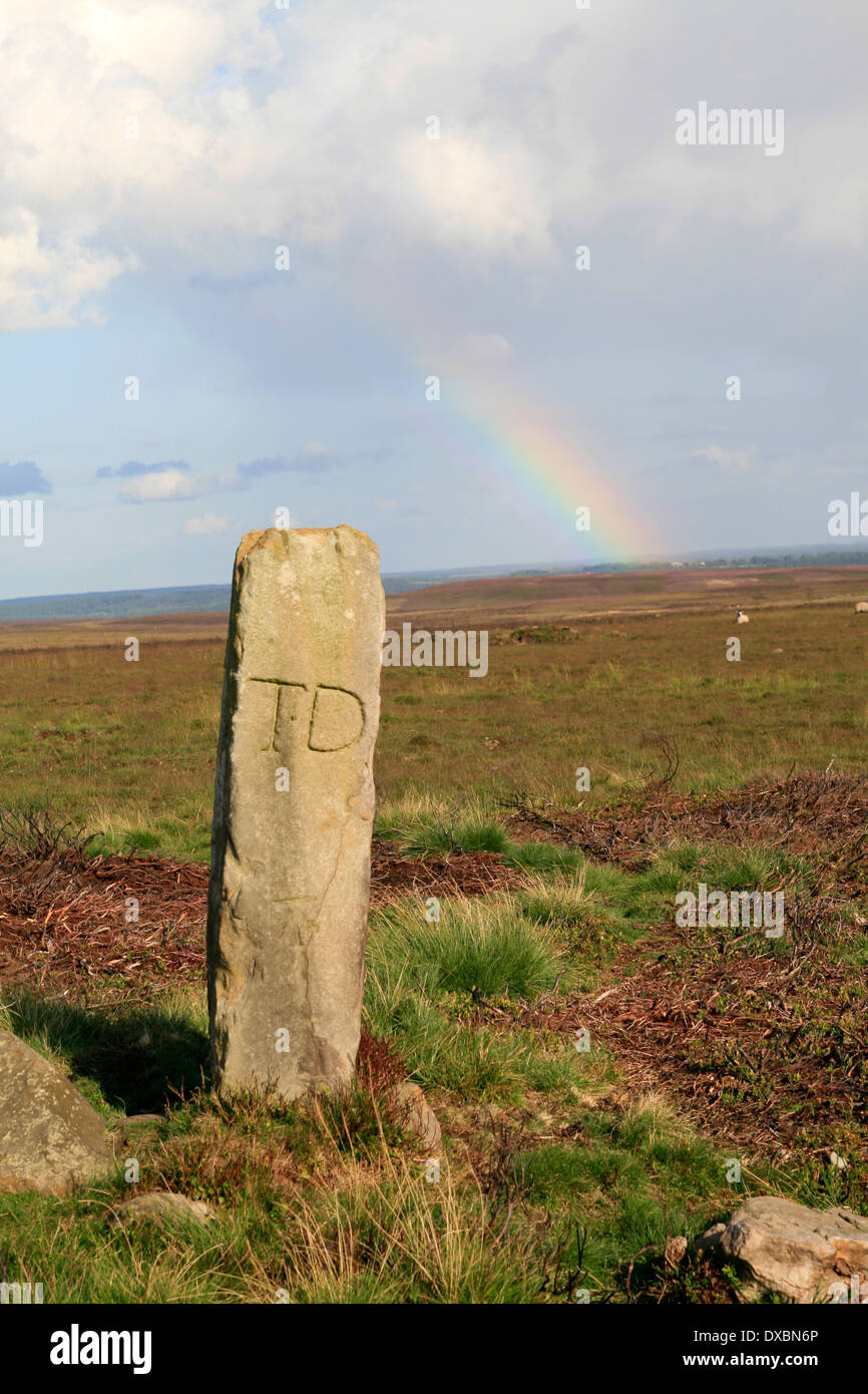boundary stone and rainbow Blakey Ridge North York Moors England UK ...