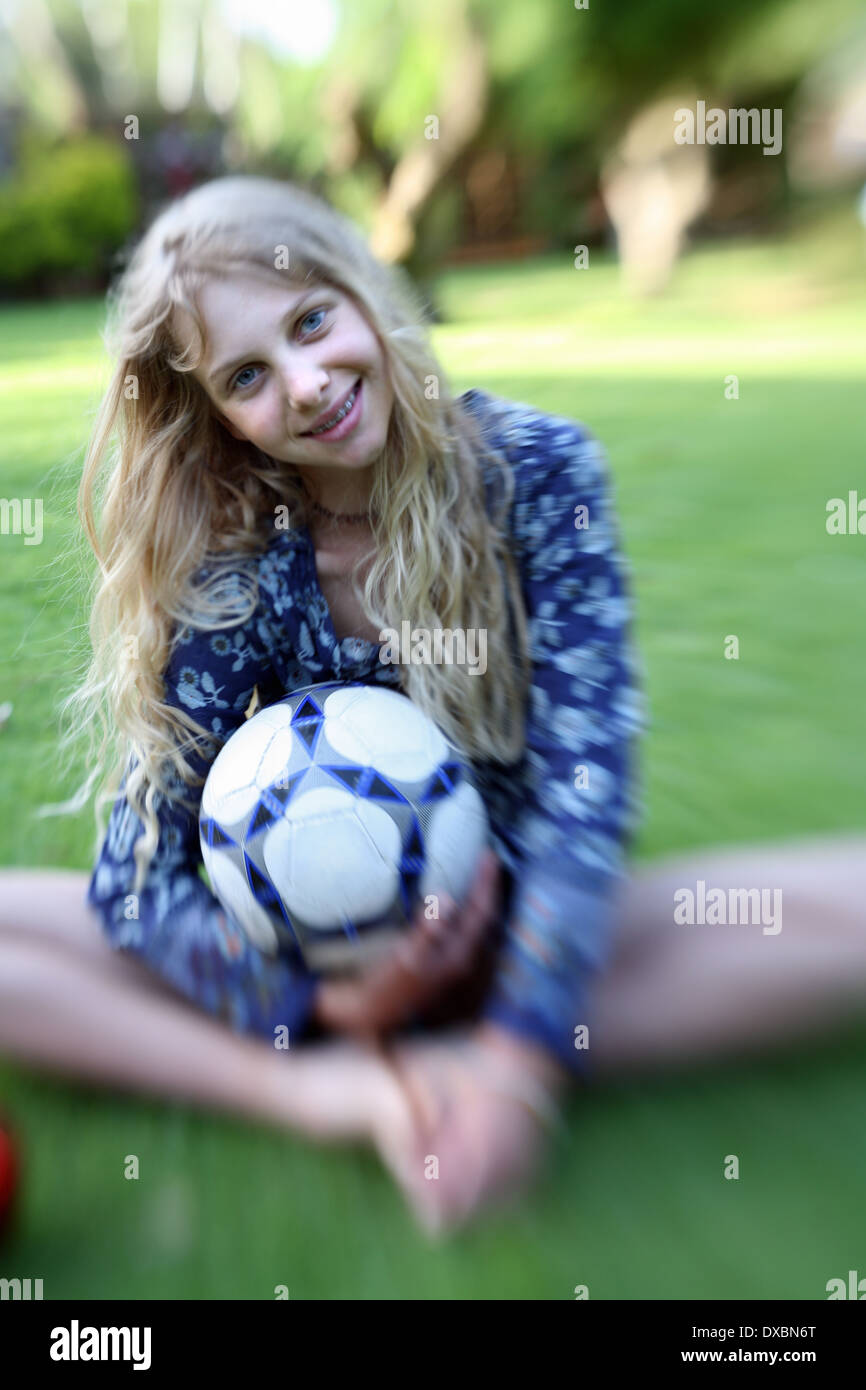 Girl posing with ball Stock Photo - Alamy