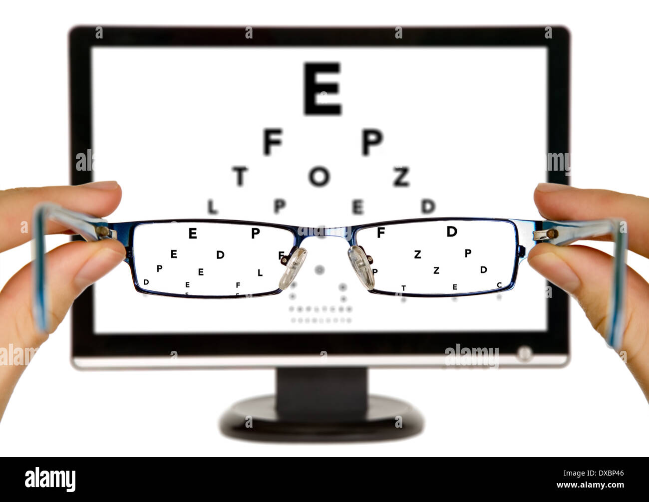 Man is viewing to eye examination chart on display through eyeglasses ...