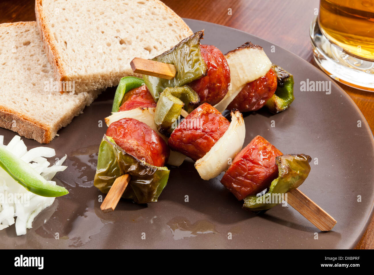 Grilled sausage on spit with the bread Stock Photo - Alamy