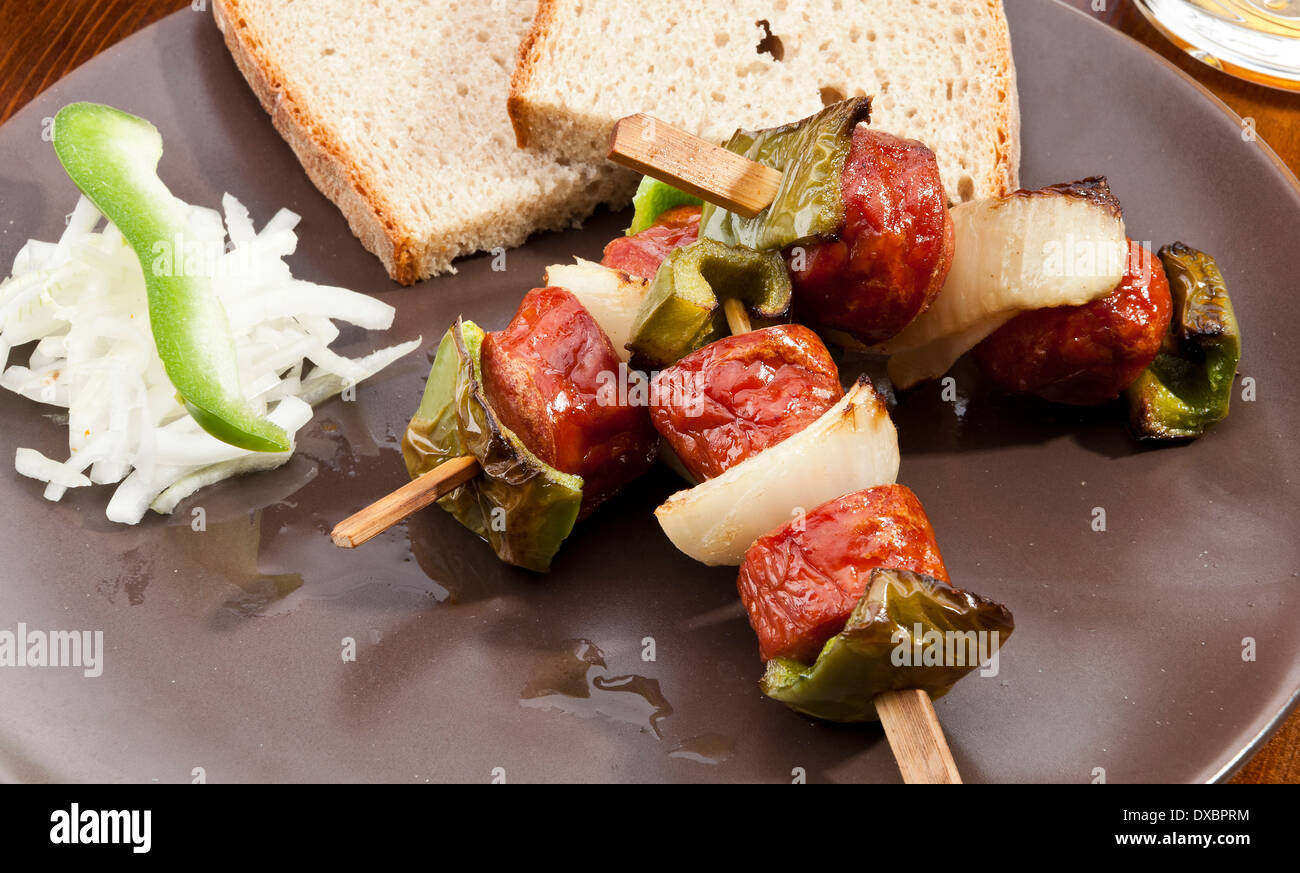 Grilled sausage on spit with the bread Stock Photo - Alamy