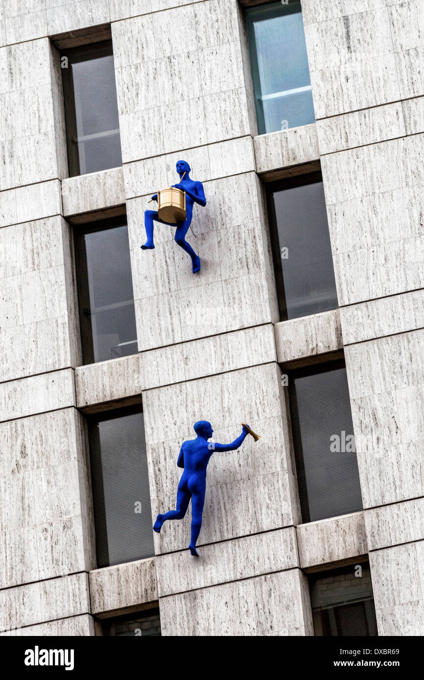 Maya House - Blue men with musical instruments climbing the building ...