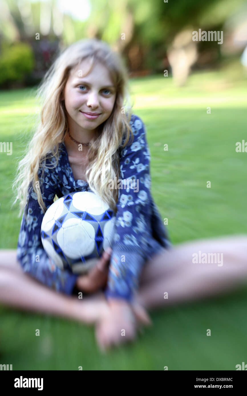 Girl posing with ball Stock Photo - Alamy