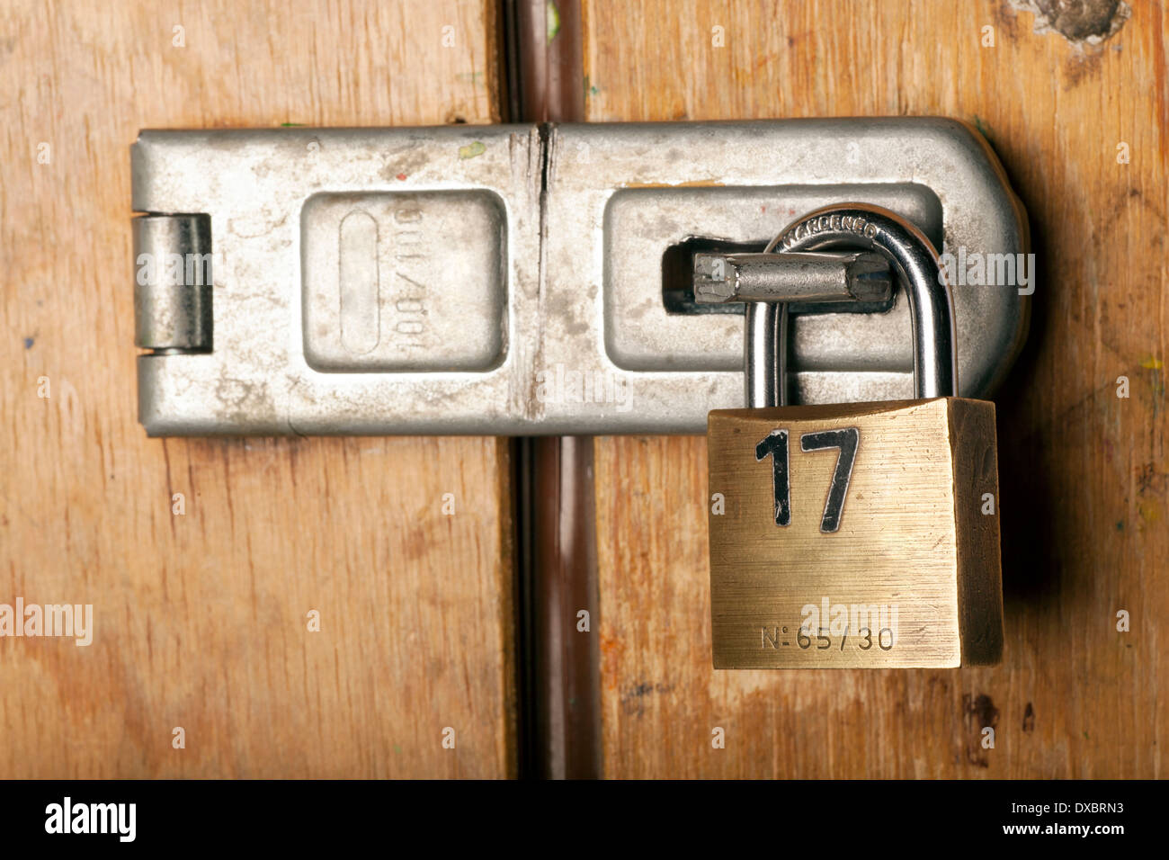 closed padlock on wood panels Stock Photo - Alamy