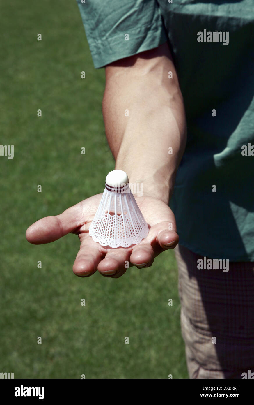 Hand holding badminton ball Stock Photo - Alamy